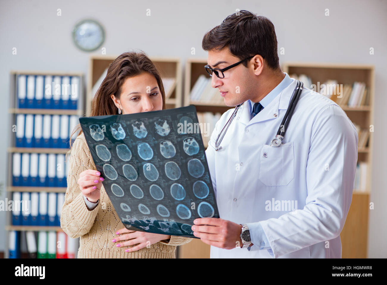 Young doctor looking at computer tomography x-ray image Stock Photo - Alamy