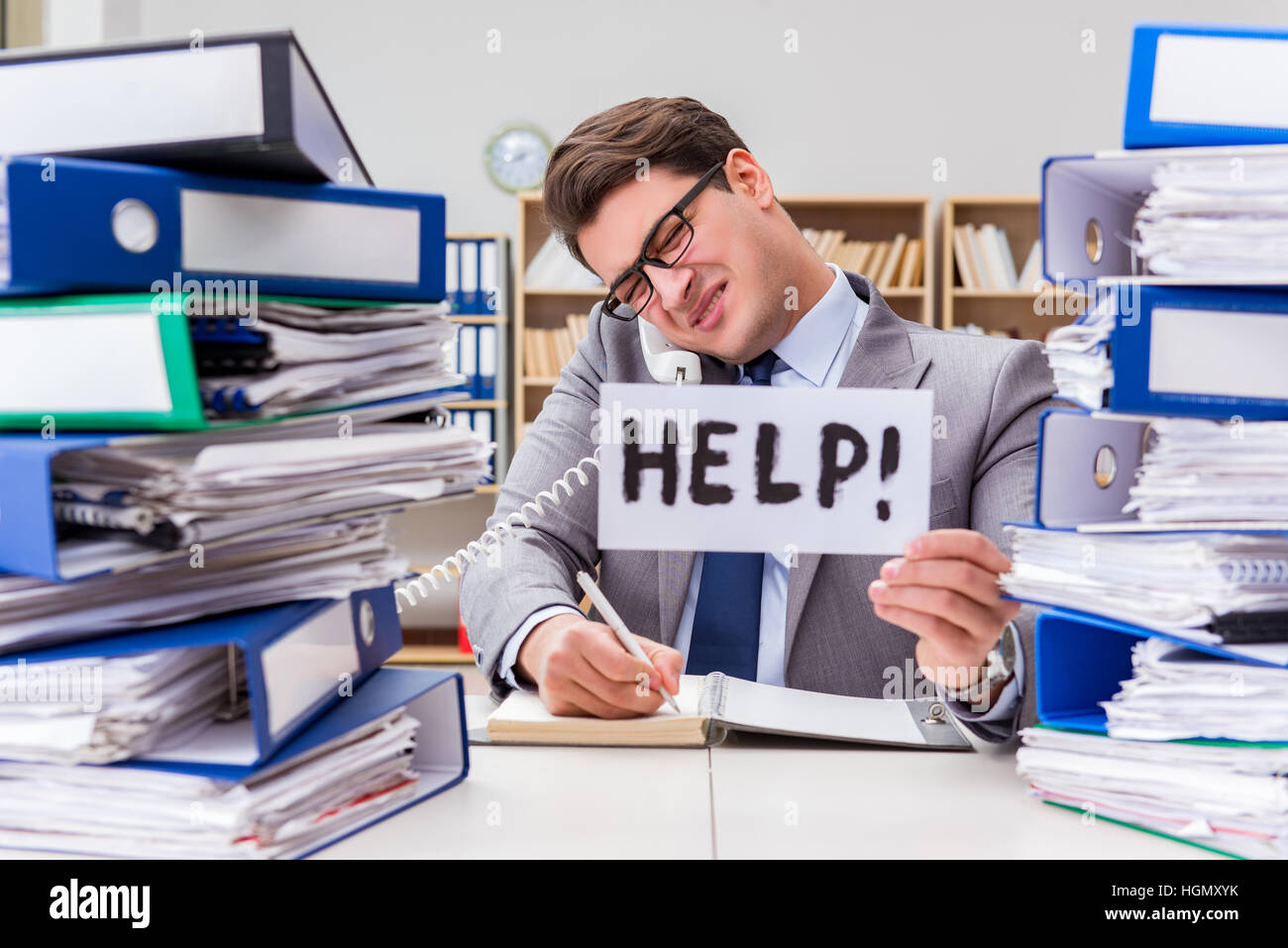 Busy businessman asking for help with work Stock Photo - Alamy