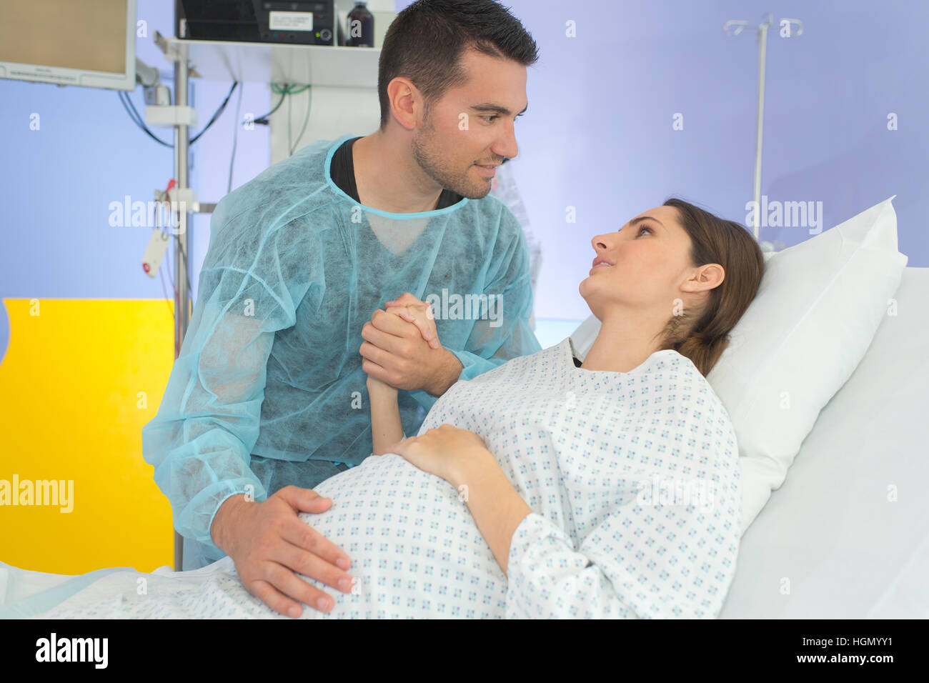 Labour holding hands pregnant hi-res stock photography and images - Alamy