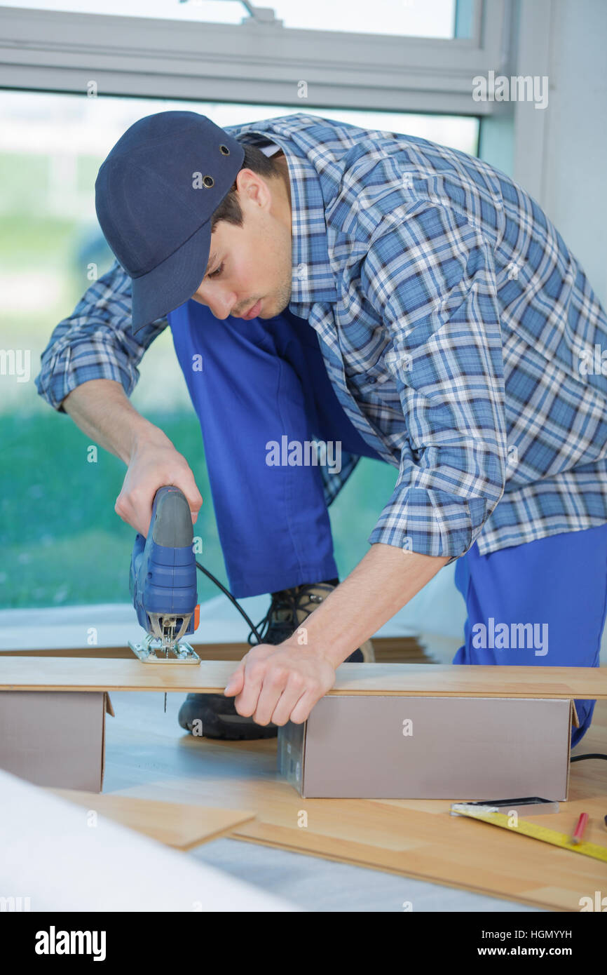 man using electric jigsaw Stock Photo - Alamy