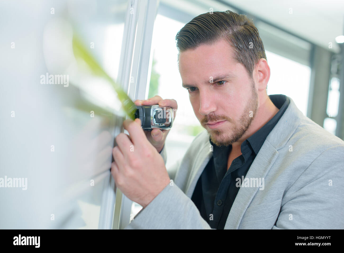 Young male tailor measuring hi-res stock photography and images - Alamy
