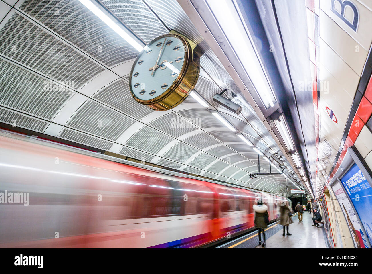 Underground Clock in an Underground Station in London with a train ...