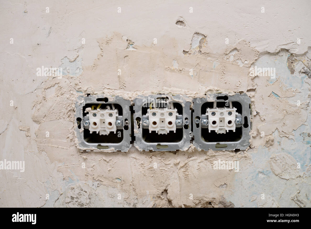 Damaged plug of abandoned building Stock Photo - Alamy