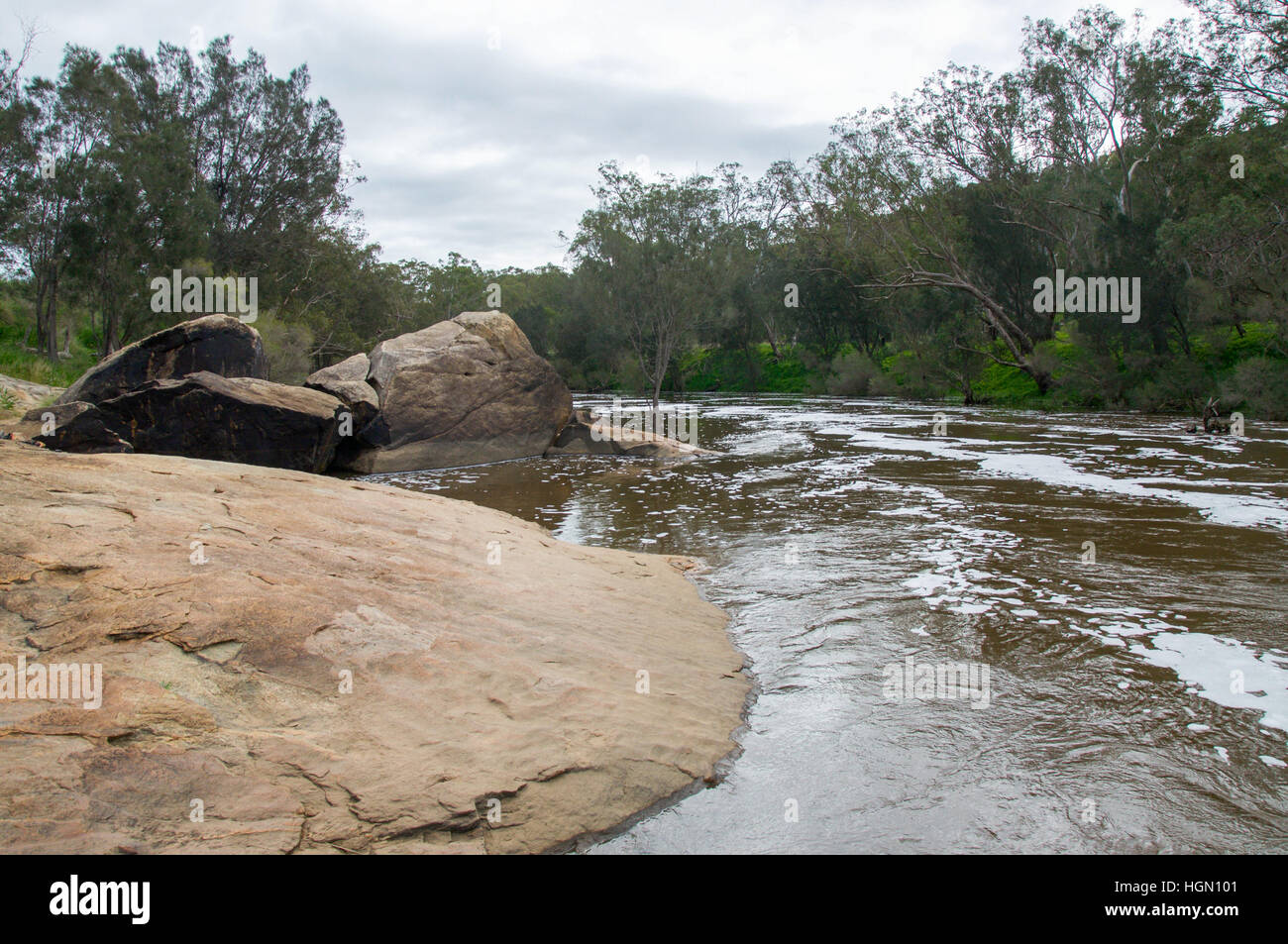 Overcast skies with large granite rock formations and the Bell Rapids ...
