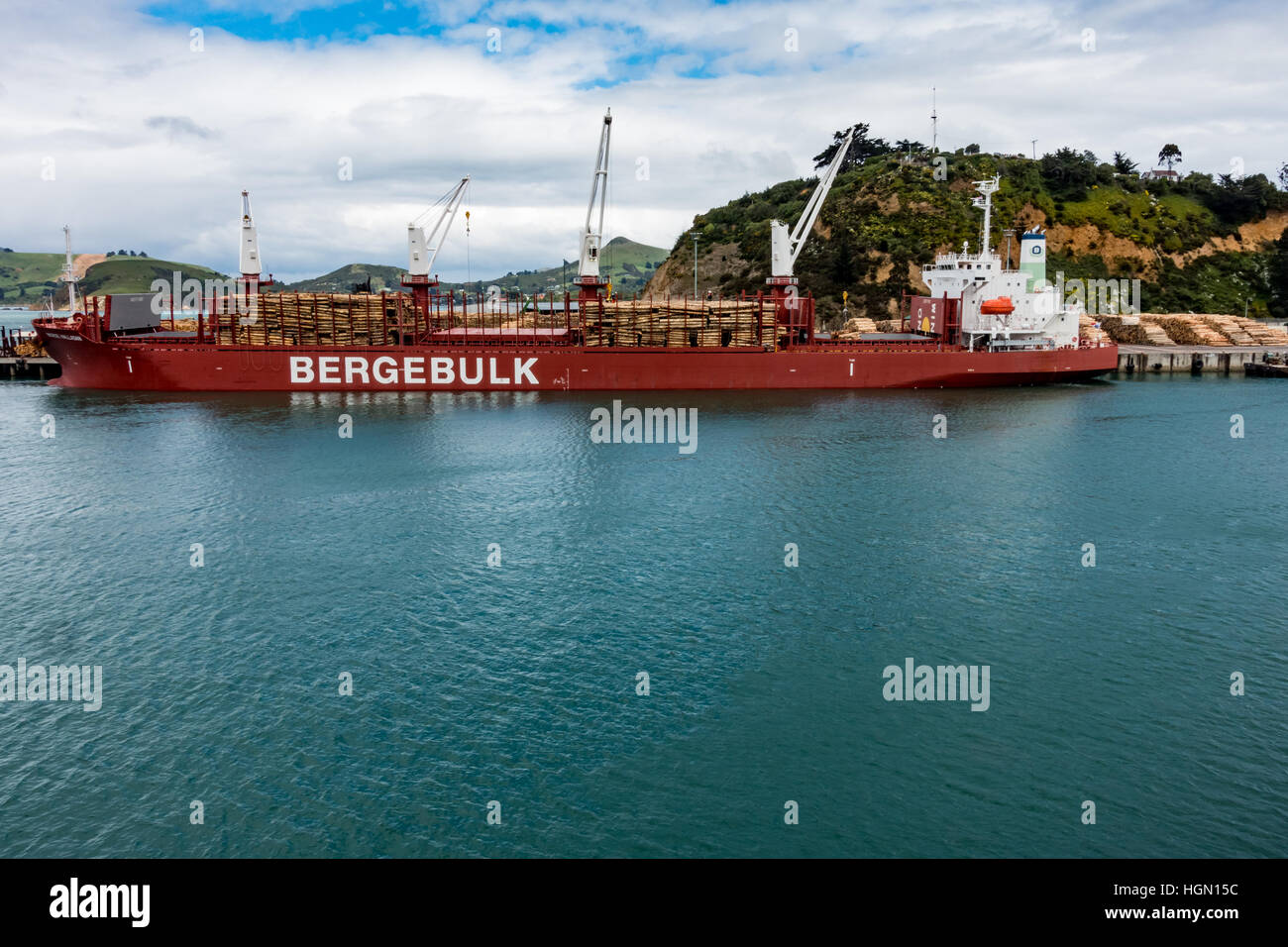 Ship loading timber logs at Port Chalmers, Otago harbour, Dunedin, New ...