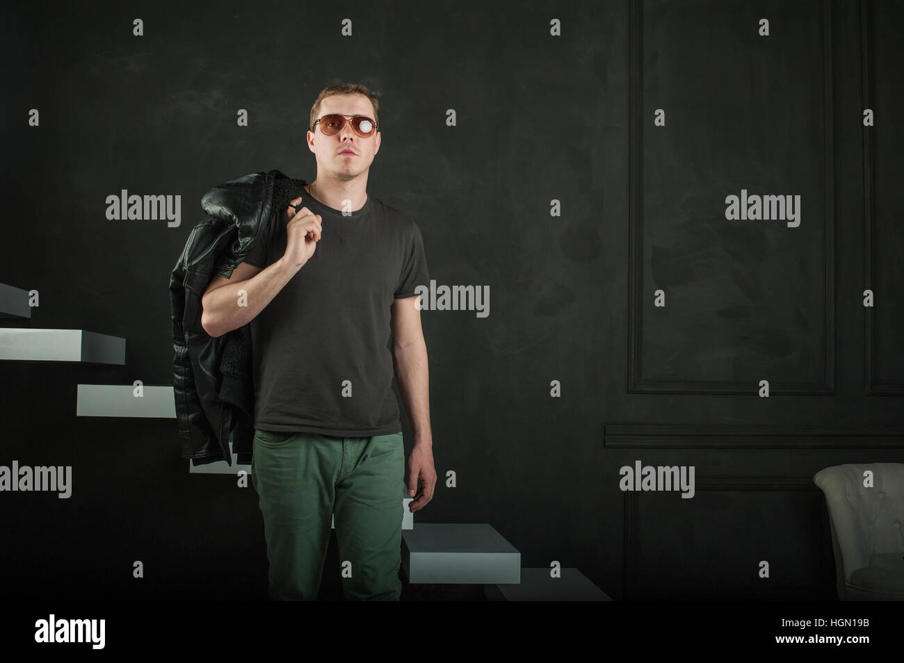 Jacket slung over shoulder hi-res stock photography and images - Alamy