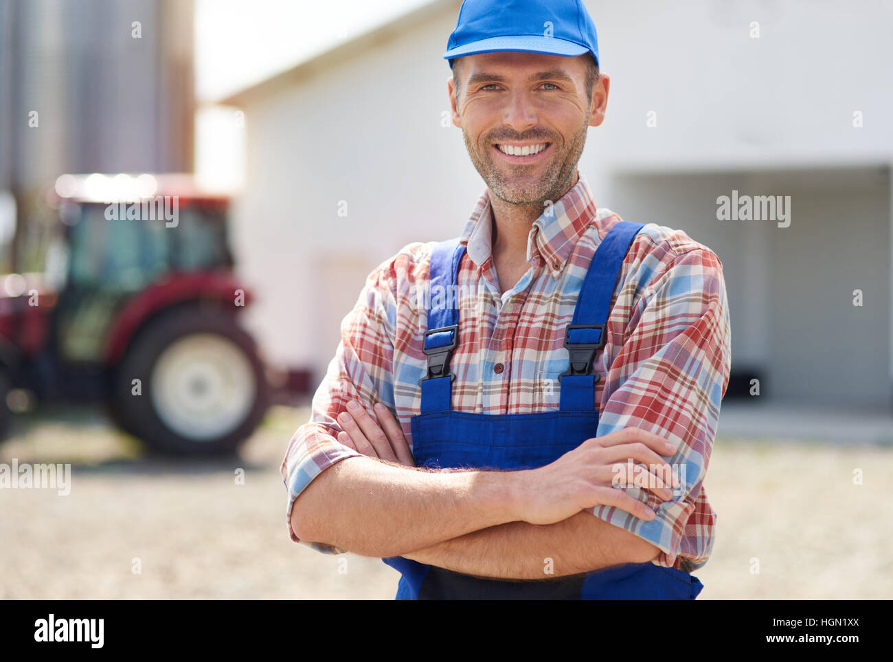 Farmer in front of his farm Stock Photo - Alamy