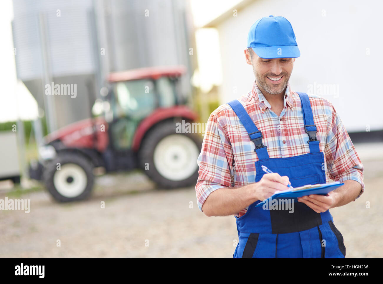 Checking some data on the farm Stock Photo - Alamy