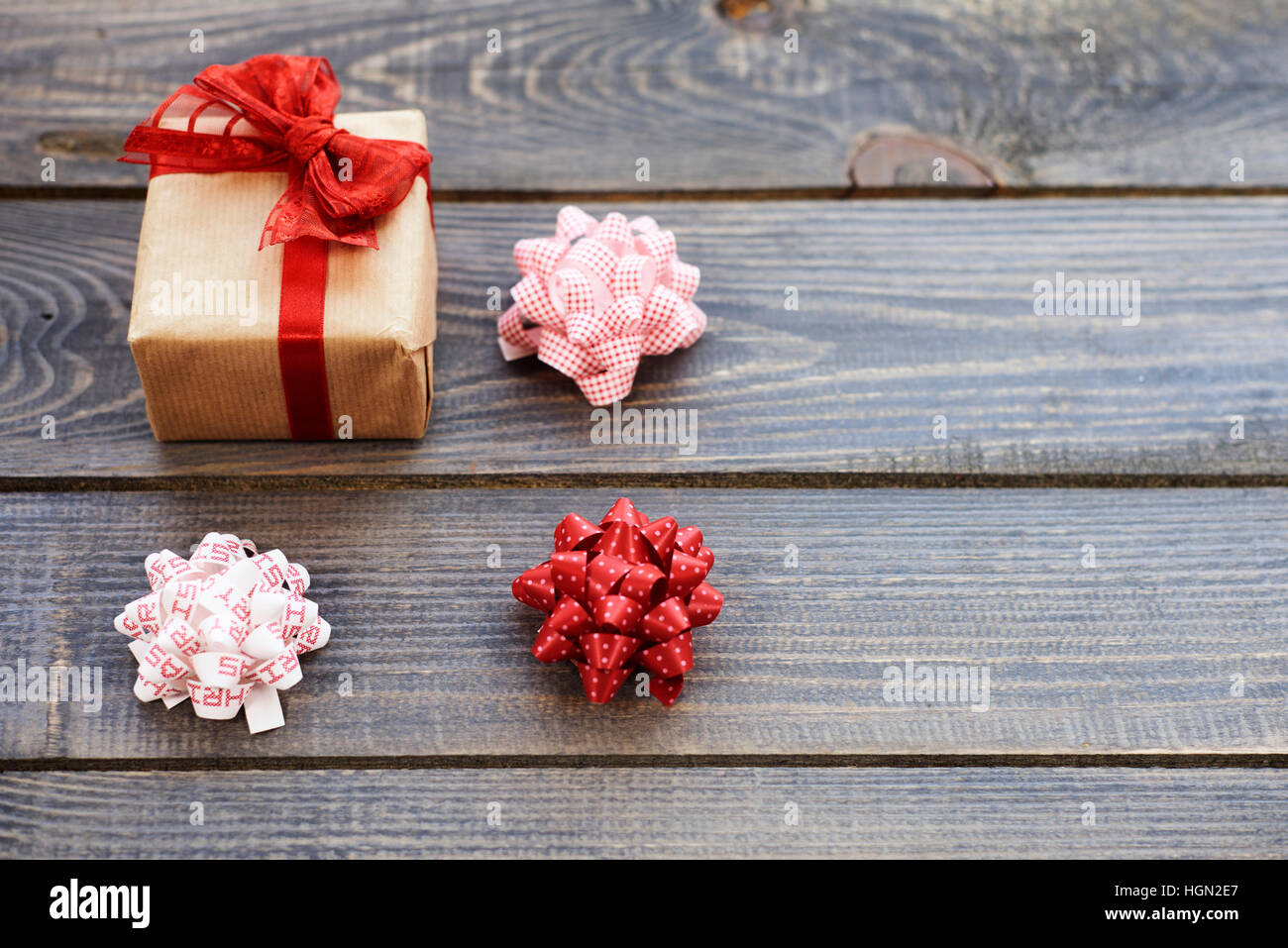 Christmas gift with three bows Stock Photo - Alamy
