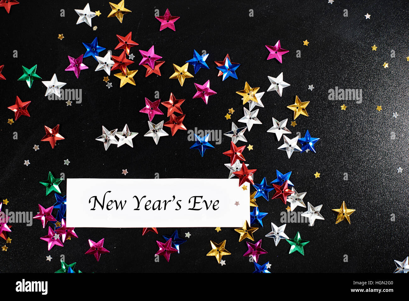 New Years Eve lettering around confetti stars Stock Photo - Alamy