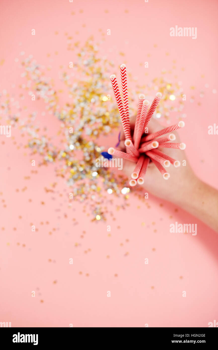 Full of drinking straws hold in hand Stock Photo - Alamy