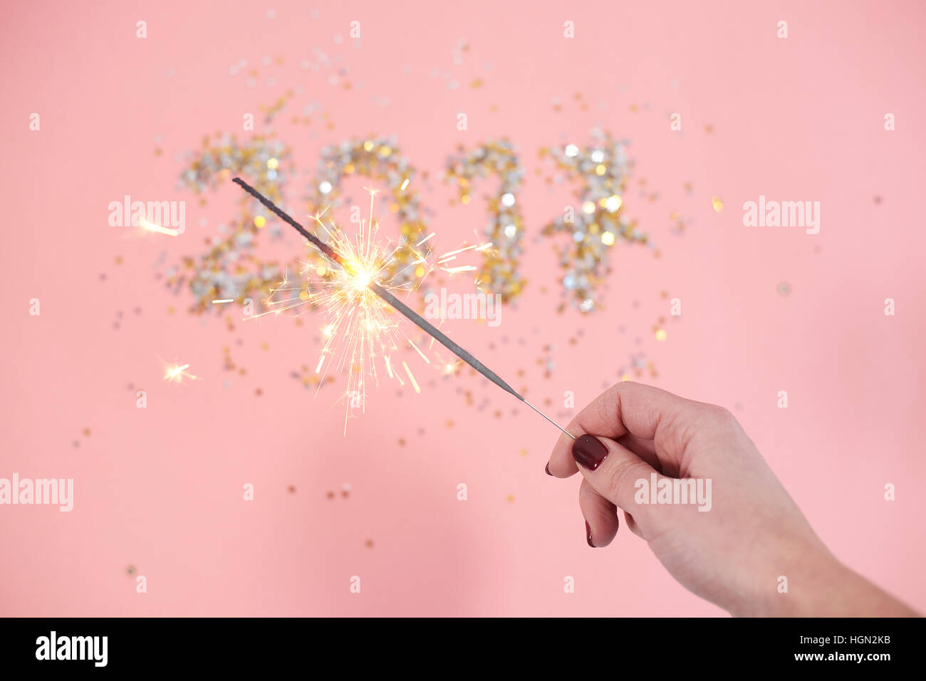 Shining sparkler on the New Years Eve background Stock Photo - Alamy