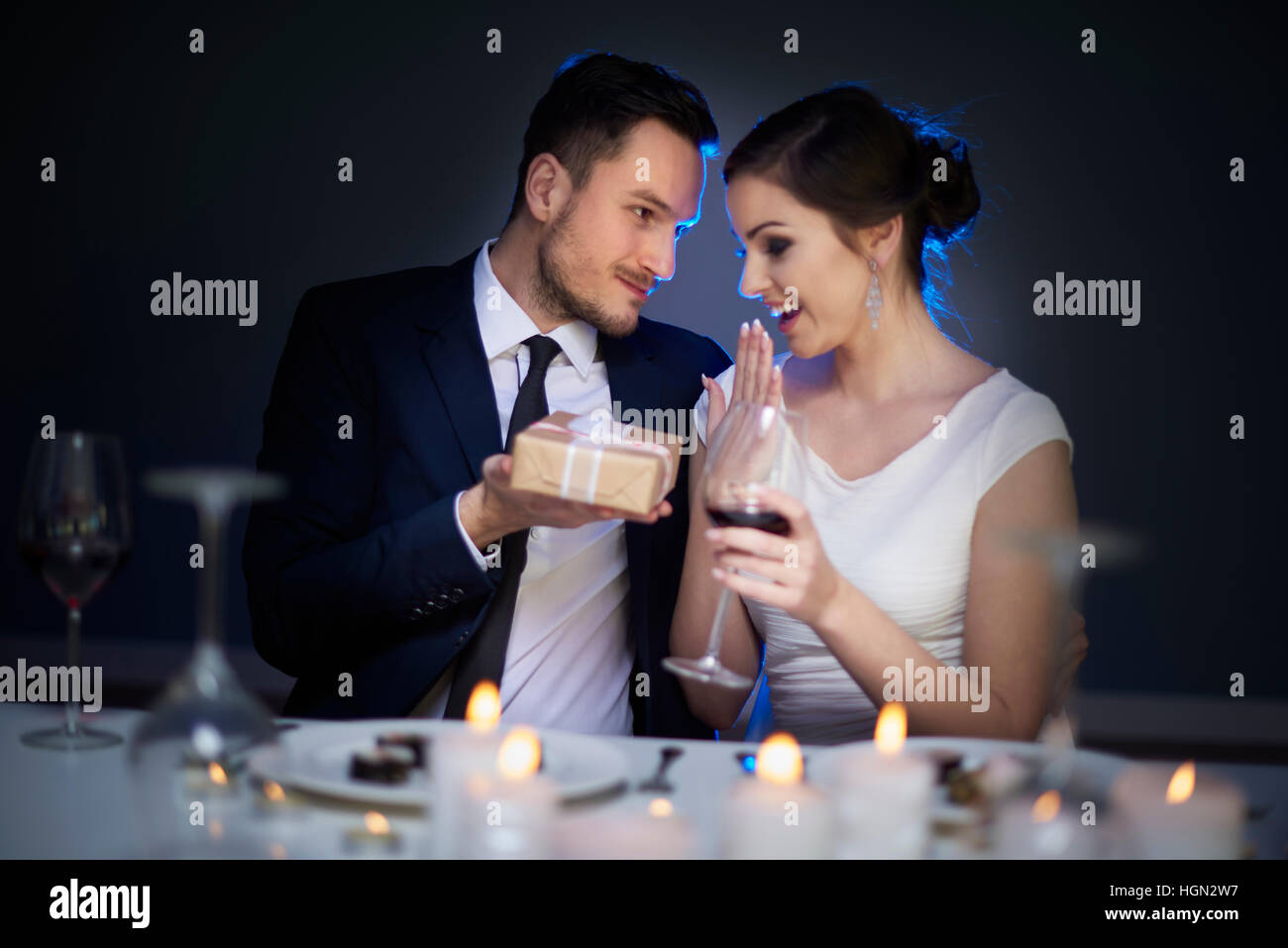 Handing drink to man hi-res stock photography and images - Alamy