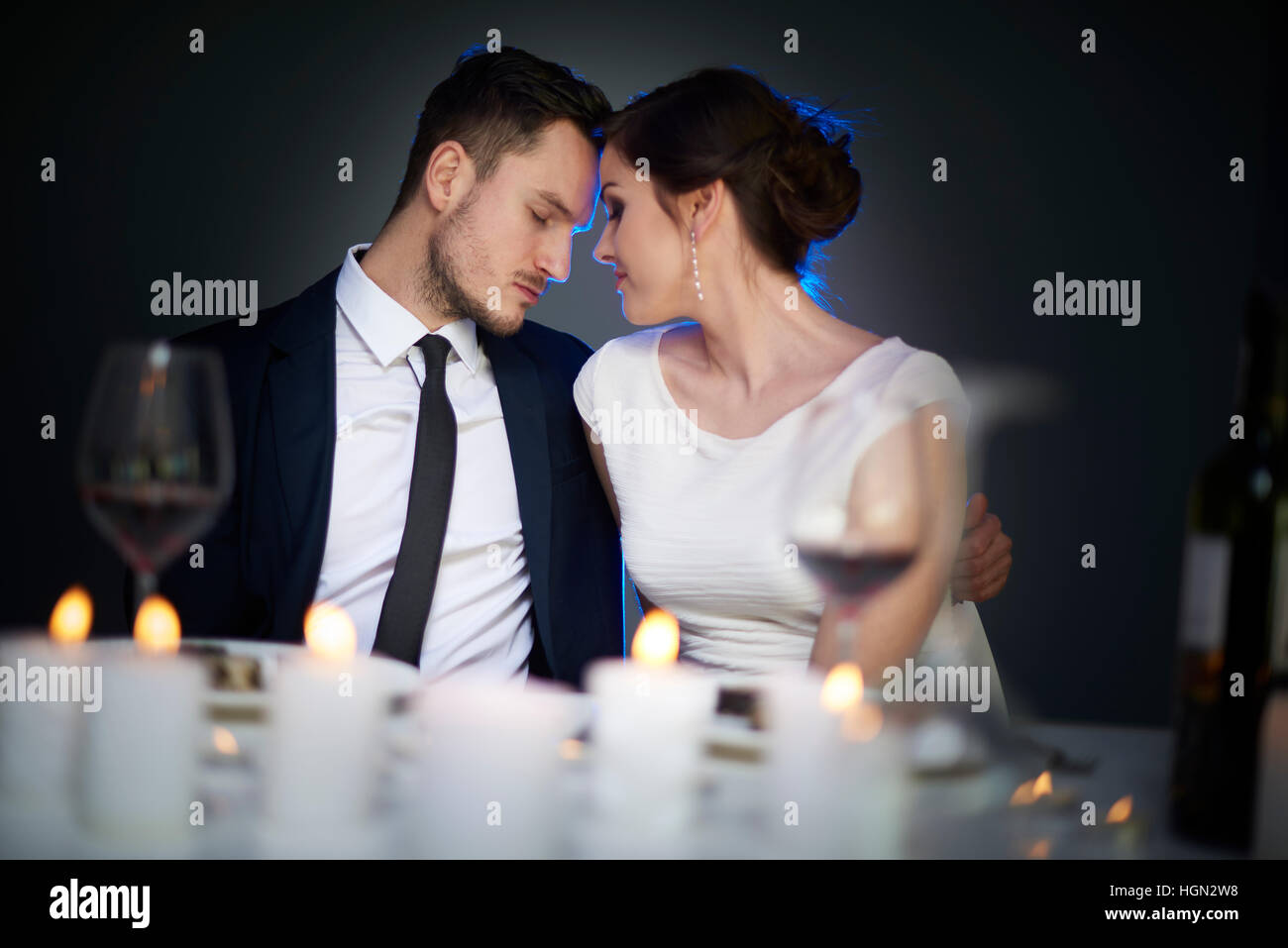 Studio shot of elegant couple having dinner Stock Photo - Alamy