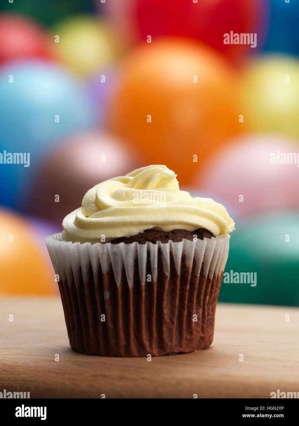 frosted cupcake with a balloon background Stock Photo - Alamy