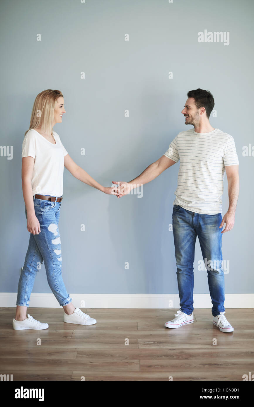Full length of couple holding hands Stock Photo - Alamy