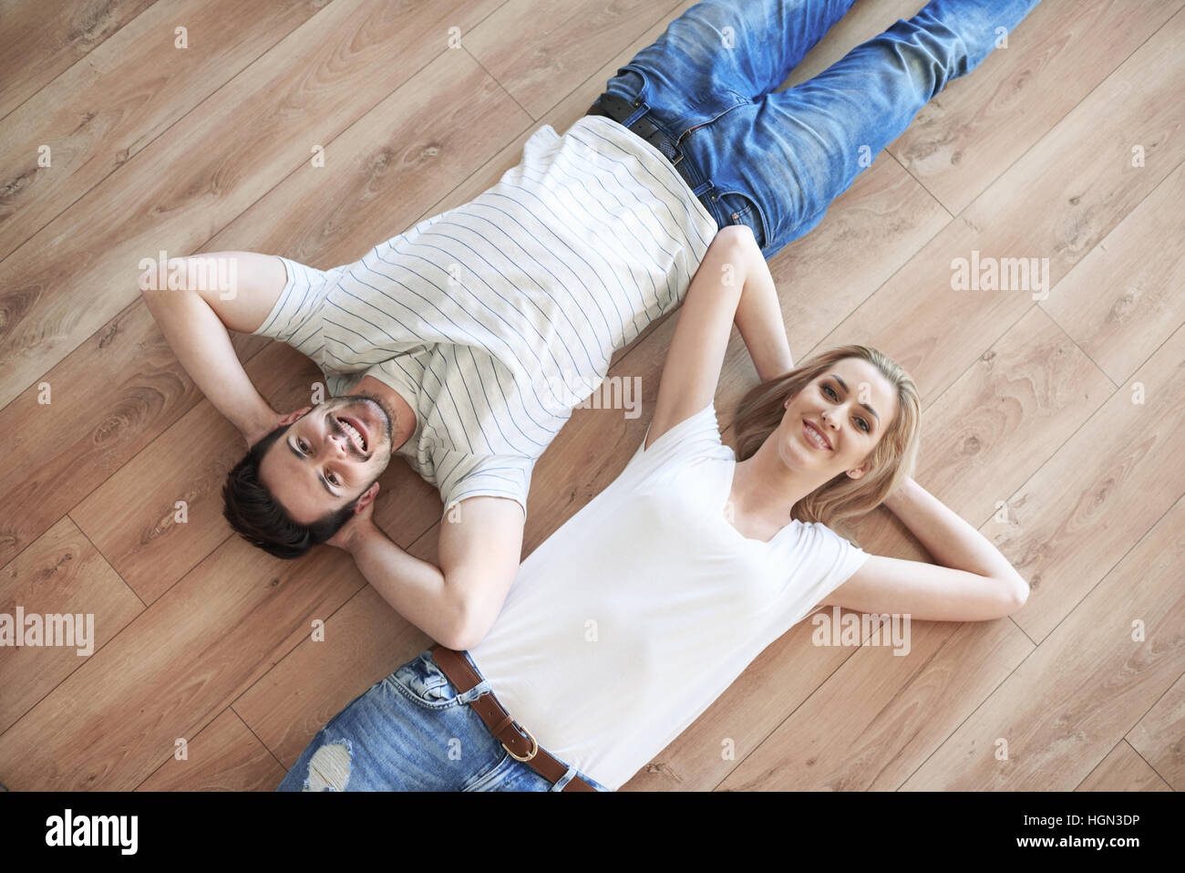 Woman lying arms behind head hi-res stock photography and images - Alamy