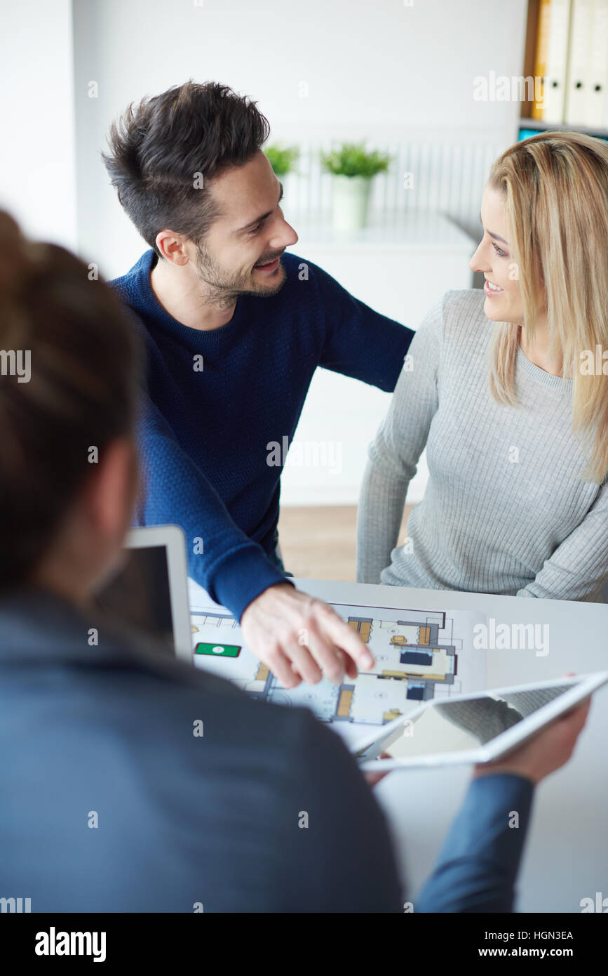 Real estate agent discussing property documents Stock Photo - Alamy