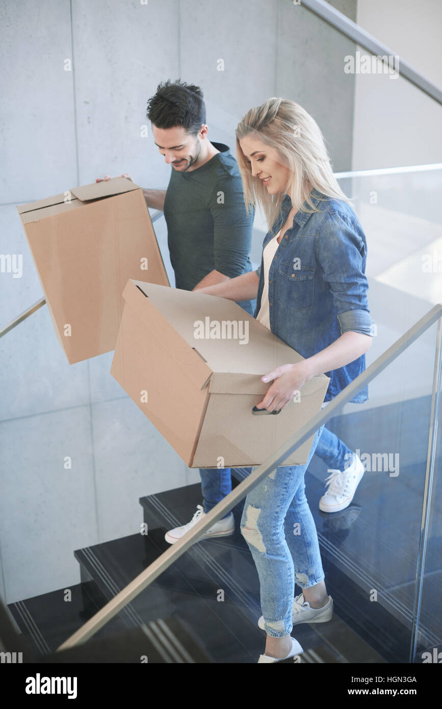 Two people busy moving house hi-res stock photography and images - Alamy