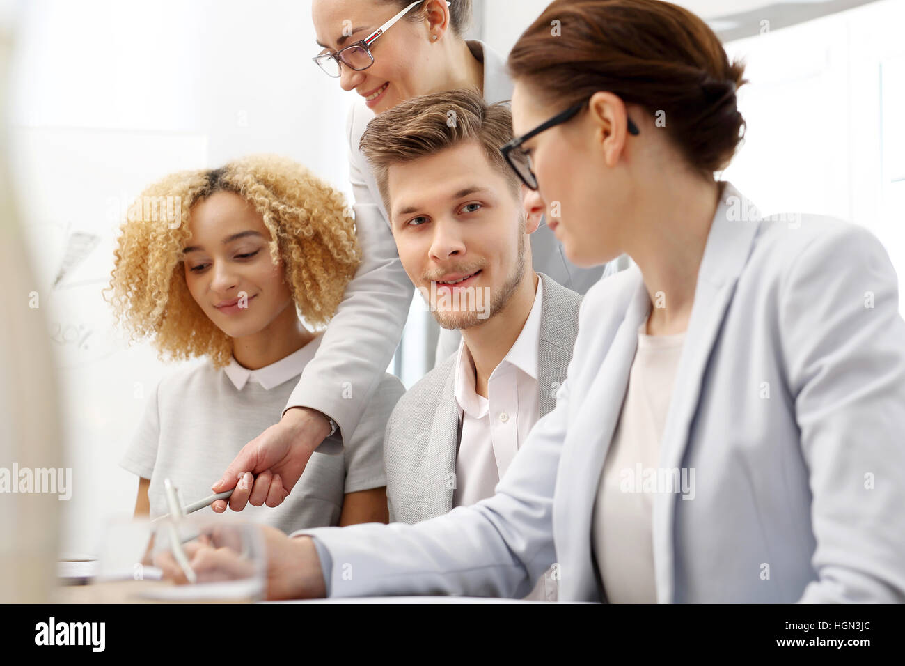 Teamwork on the project. A group of office workers in a meeting in the ...