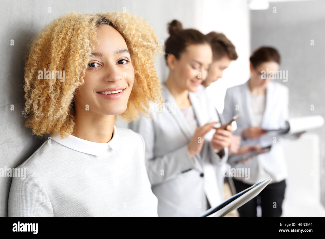 Recruitment in the company. Job search. Smiling young woman waiting for ...