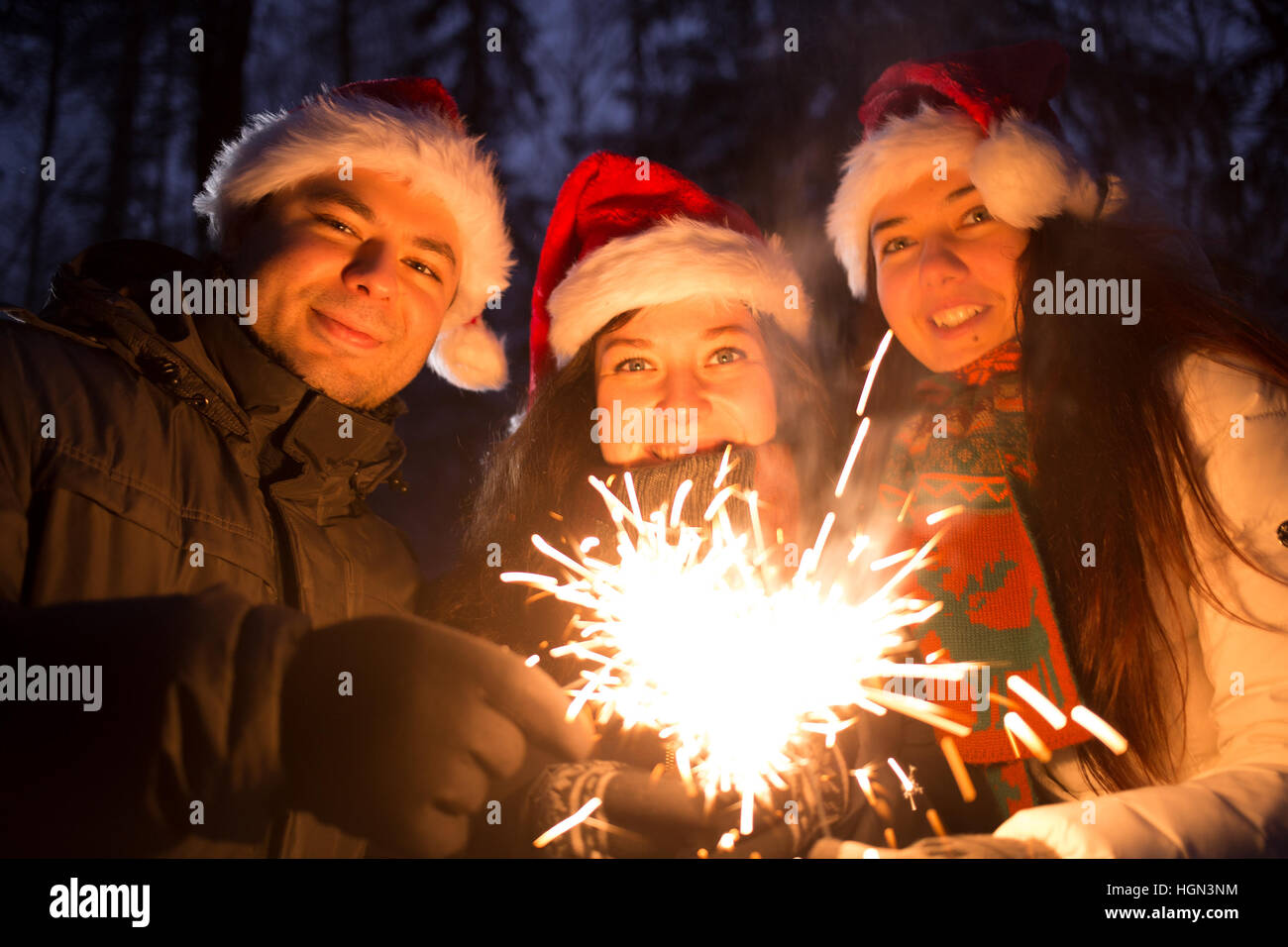 Christmas photo of cheerful friends Stock Photo - Alamy