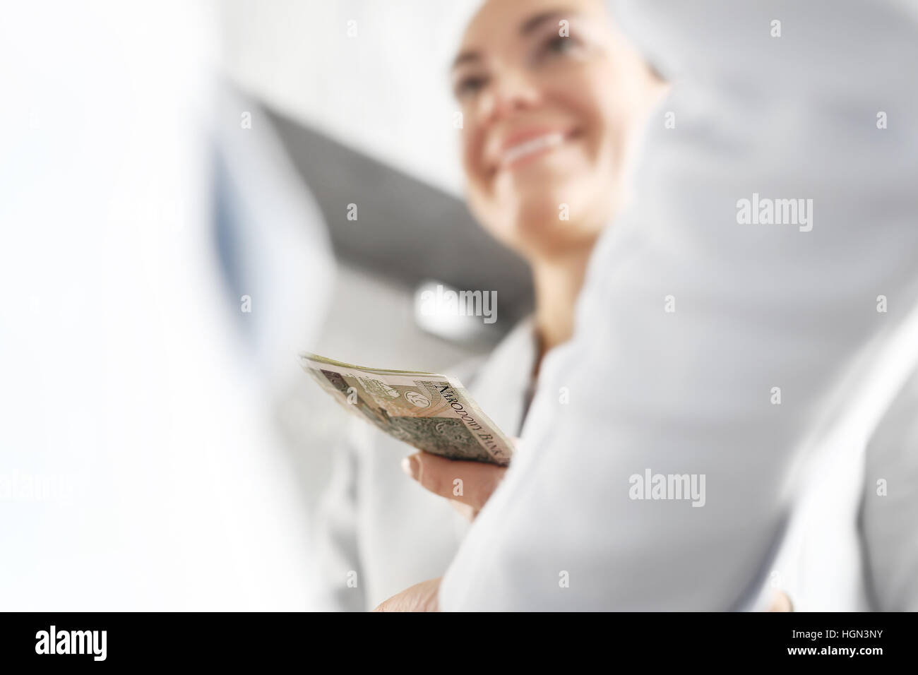 Money. File banknotes passed from hand to hand. The remuneration for a ...