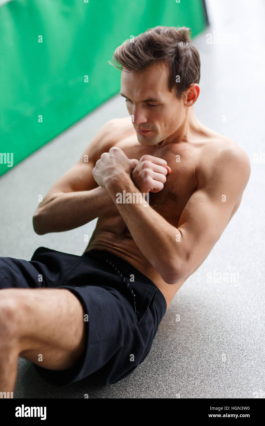 Strong man practicing abdominal hi-res stock photography and images - Alamy