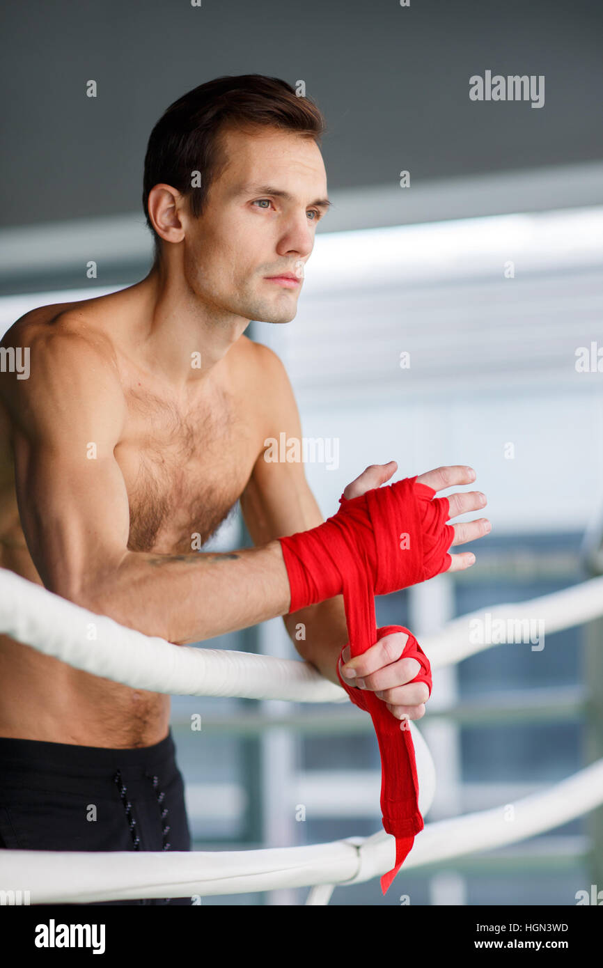 Athletic man with boxing bandages Stock Photo - Alamy