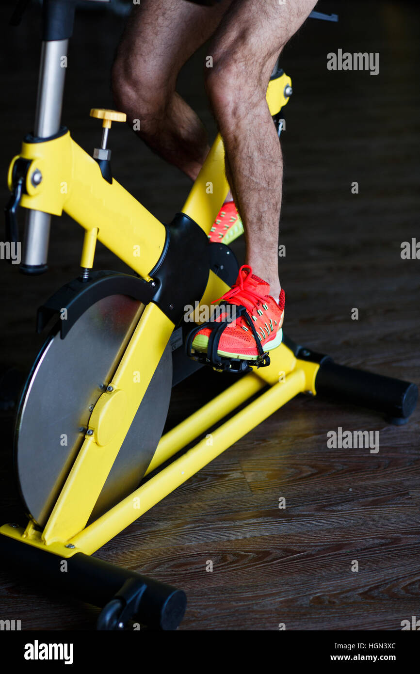 Man training on exercise bike Stock Photo - Alamy