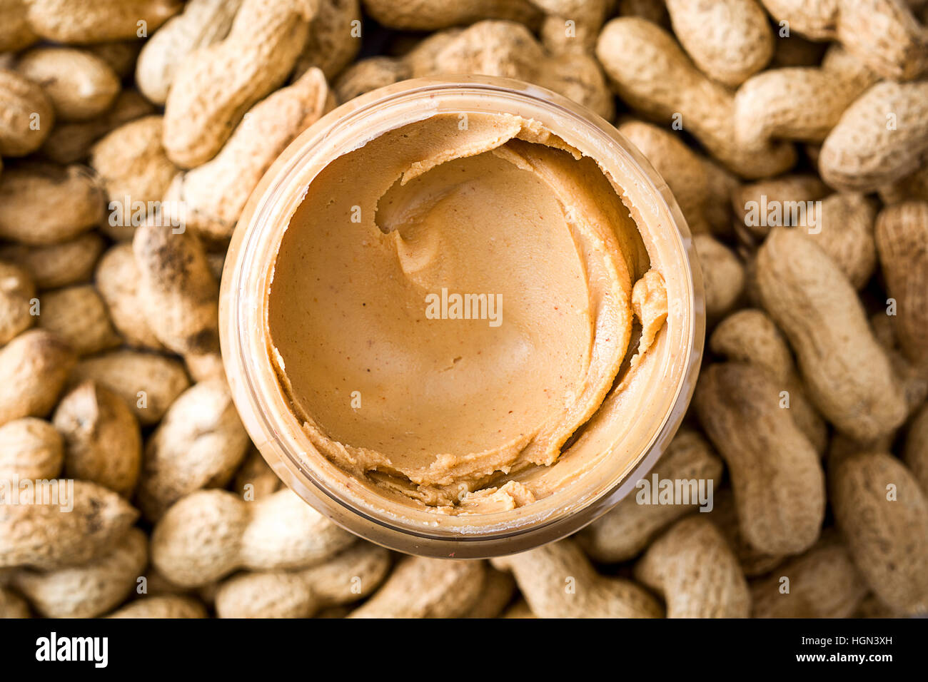 Creamy peanut butter on peanut background.Overview Stock Photo - Alamy