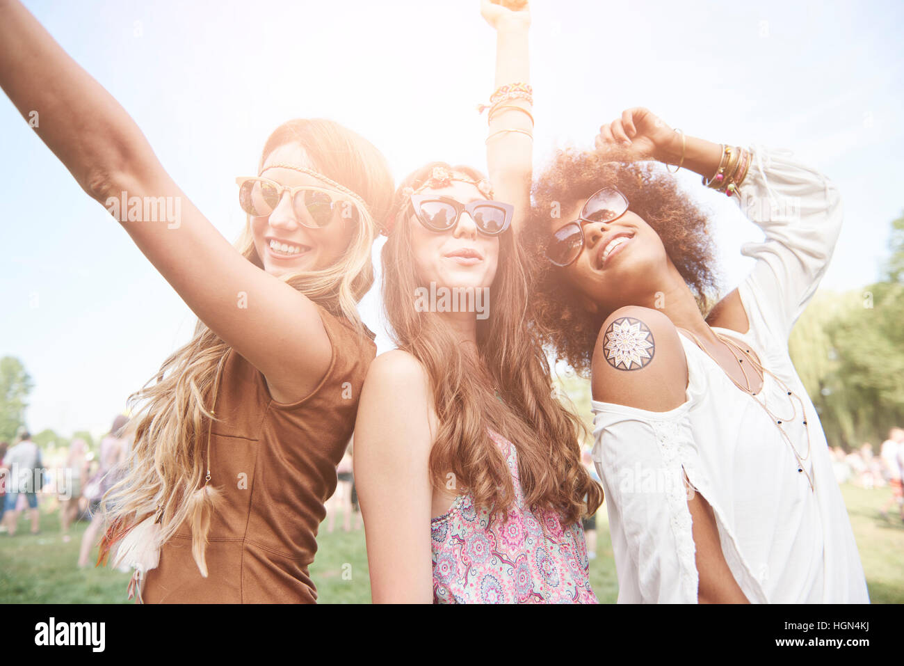 Three best friends at the music festival Stock Photo - Alamy