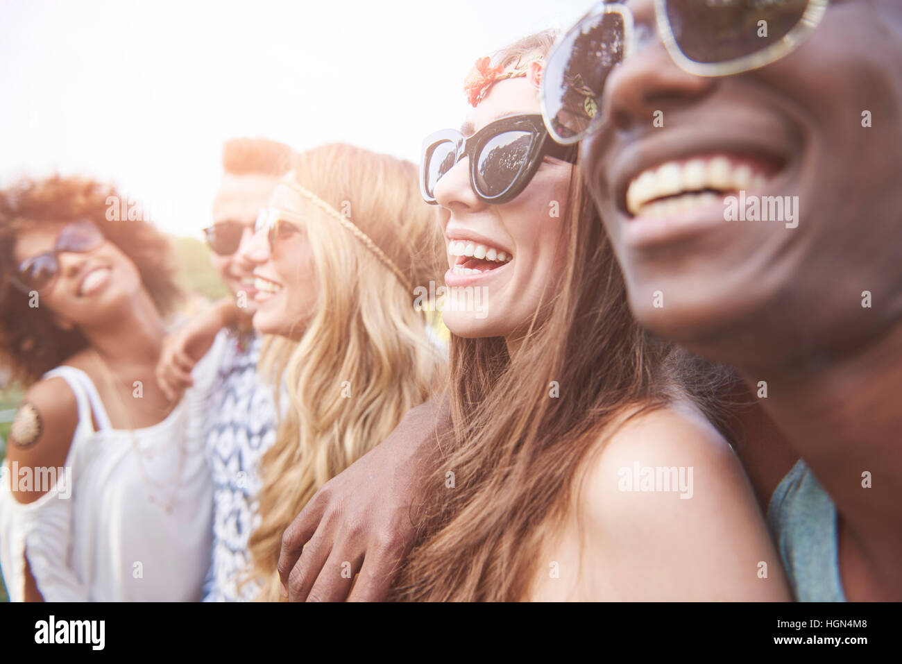 Side view of friends at the traveling carnival Stock Photo - Alamy