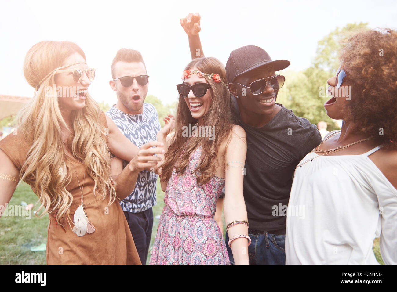 Group of friends dancing outdoors Stock Photo - Alamy