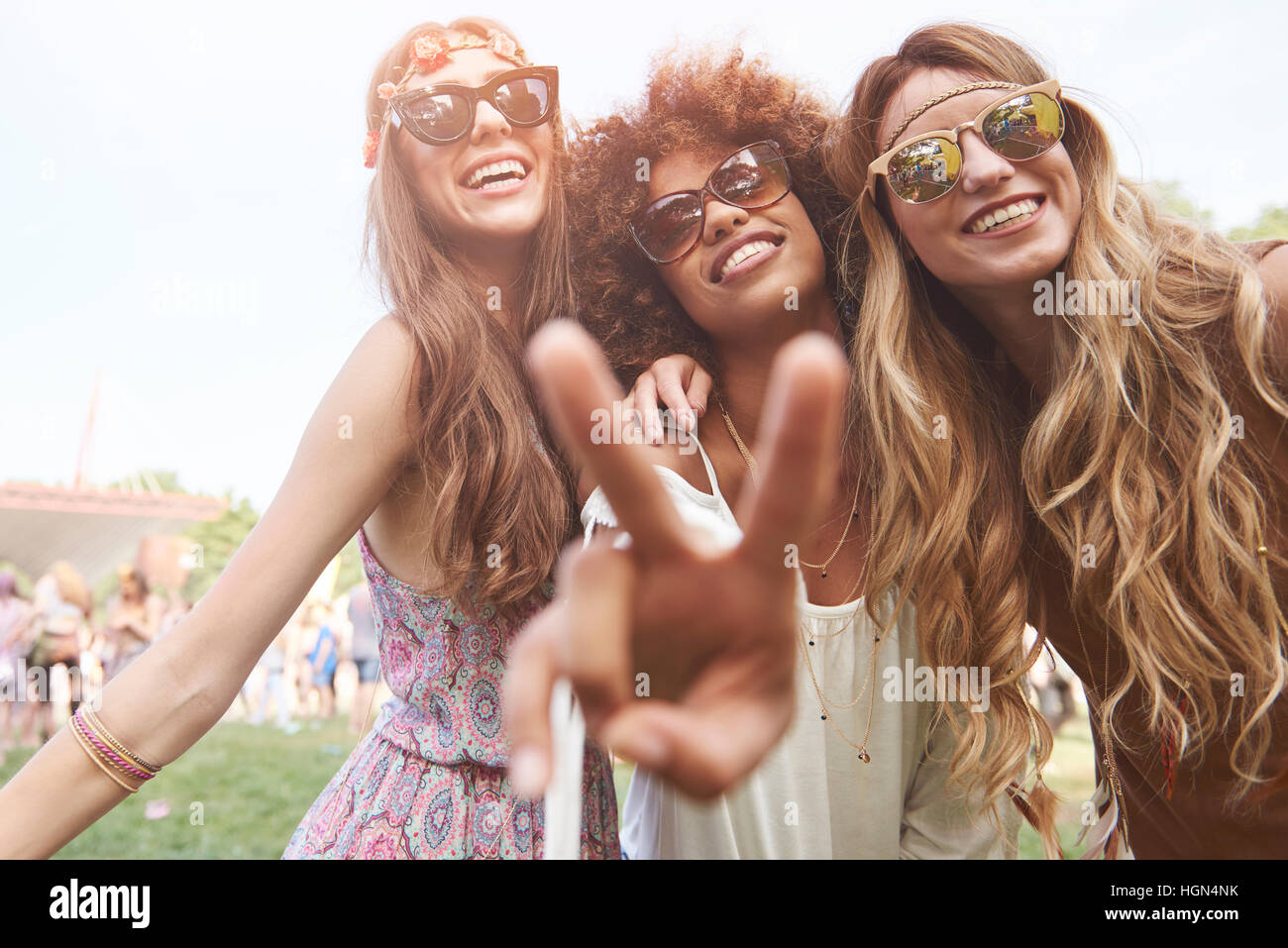 Peace sign and three friends Stock Photo - Alamy