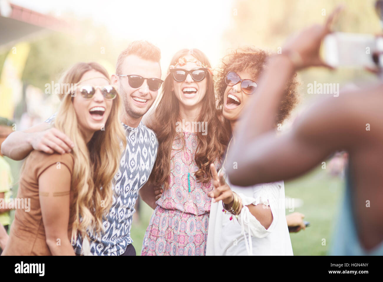 Man taking photos of his friends Stock Photo - Alamy
