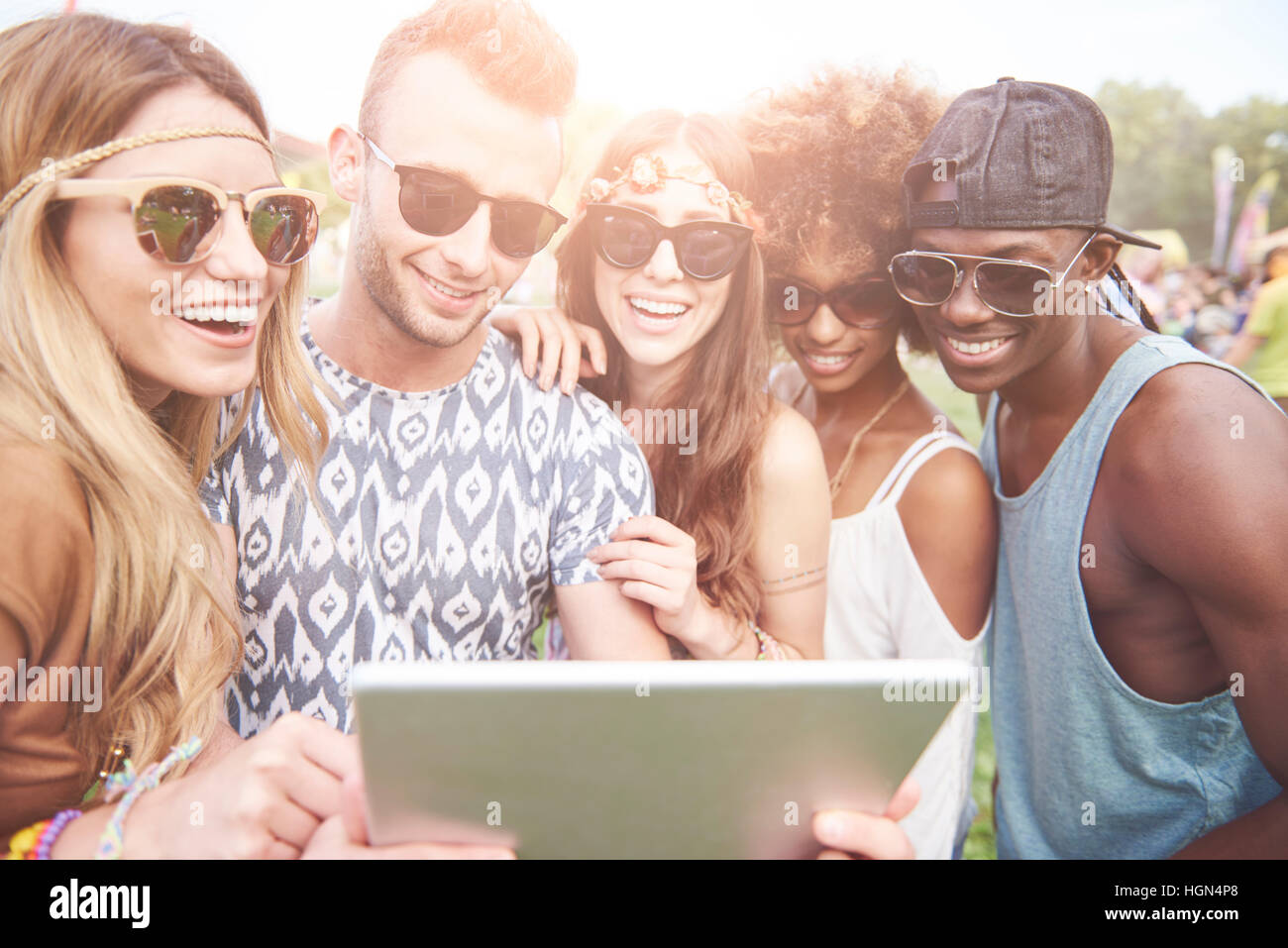 Digital tablet held by young people Stock Photo - Alamy
