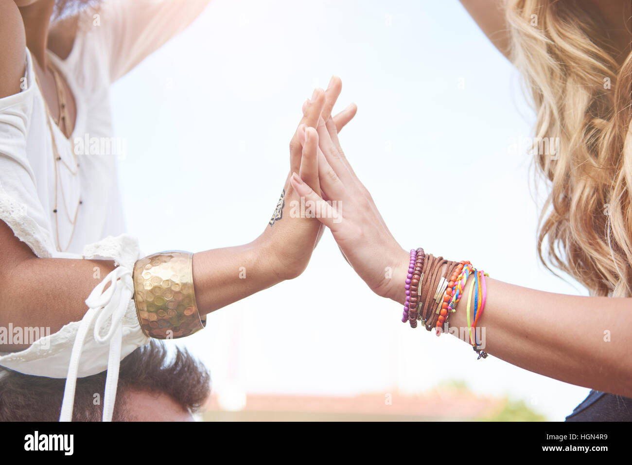 Friendship bracelets hands hi-res stock photography and images - Alamy