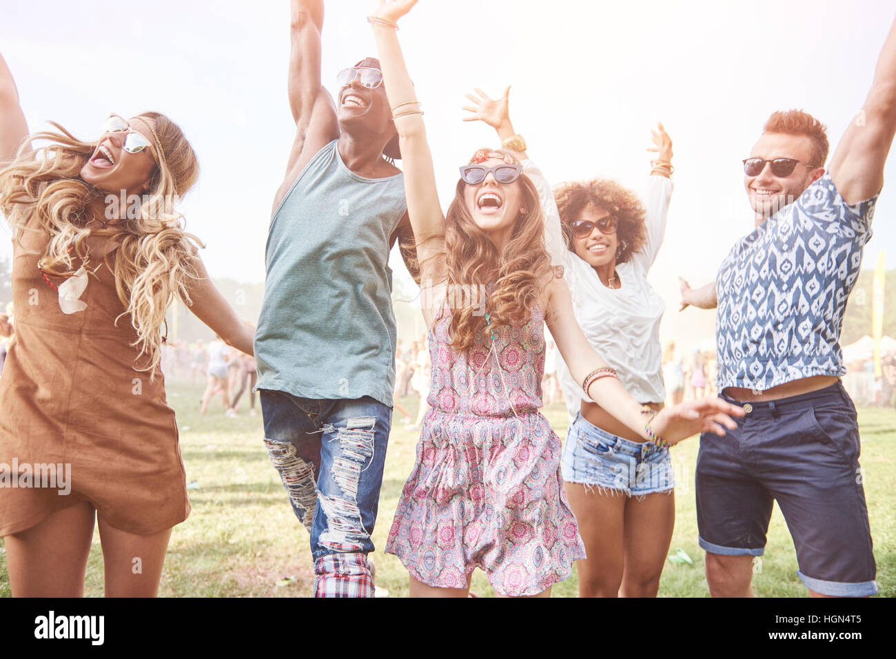 Everybody jumping and raising hands Stock Photo - Alamy