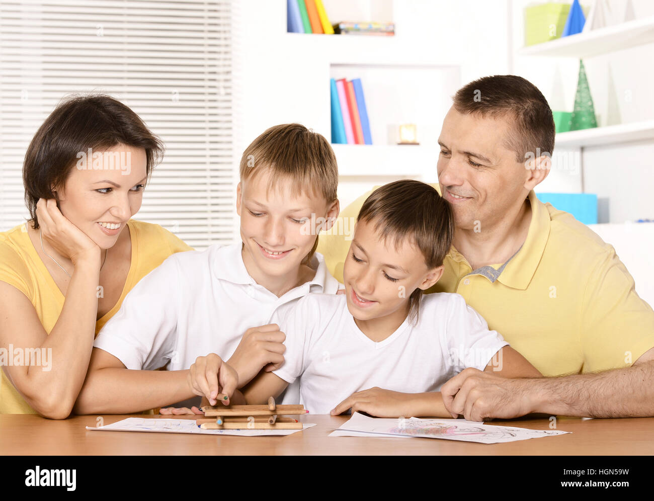 parents drawing with sons Stock Photo - Alamy