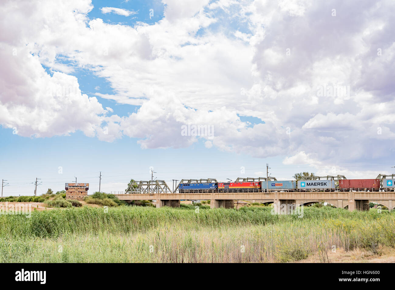 MODDERRIVIER, SOUTH AFRICA - DECEMBER 25, 2016: A train crossing the ...
