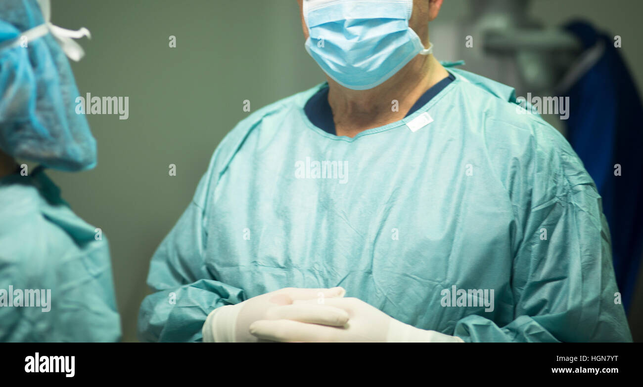 Surgeon in hospital surgery in sterile uniform "scrubs" in operating ...