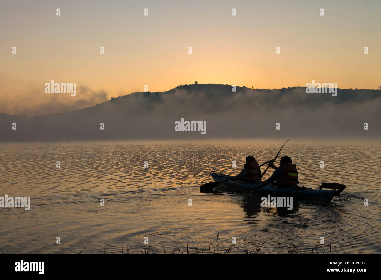 canoe kayak early morning dawn sunrise golden gold Stock Photo - Alamy