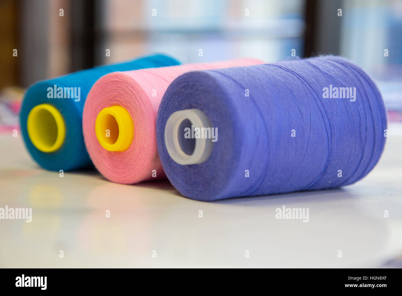 Thread rolls colorful Stock Photo - Alamy
