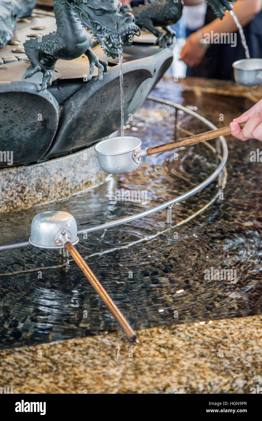 Ritual drinking water at the Asakusa temple in Tokyo, Japan Stock Photo ...