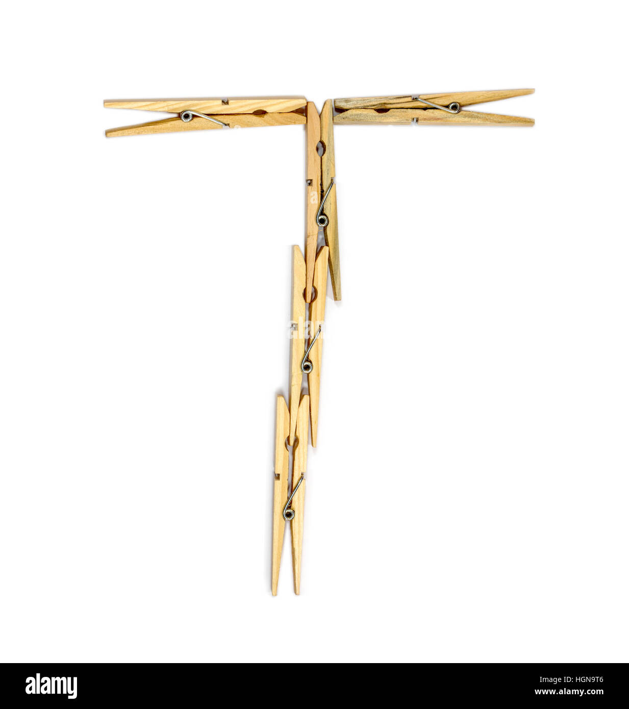 Letter T made of wooden clothespins isolated on white Stock Photo - Alamy