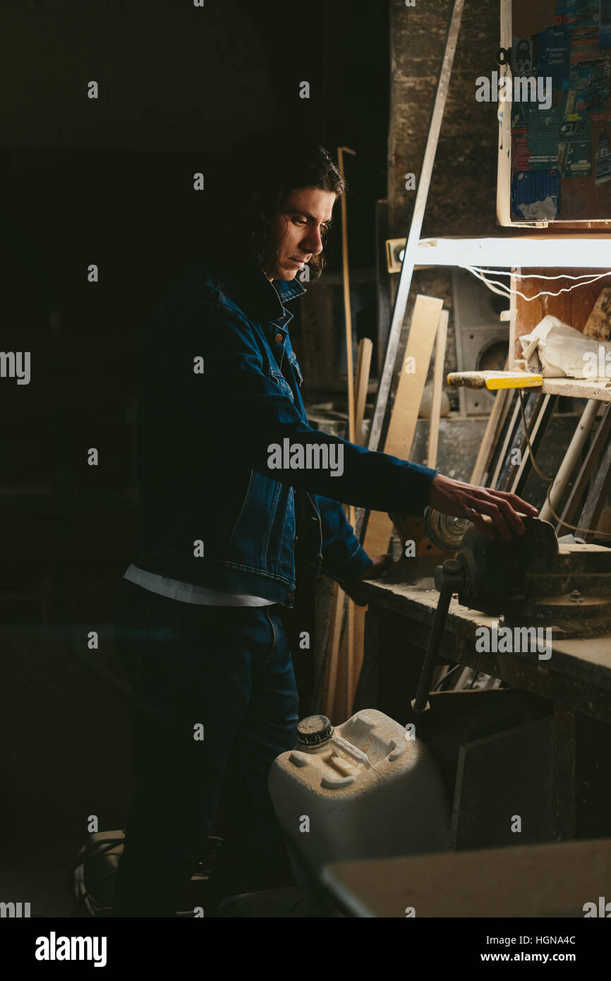 guy working at the bench one night Stock Photo - Alamy
