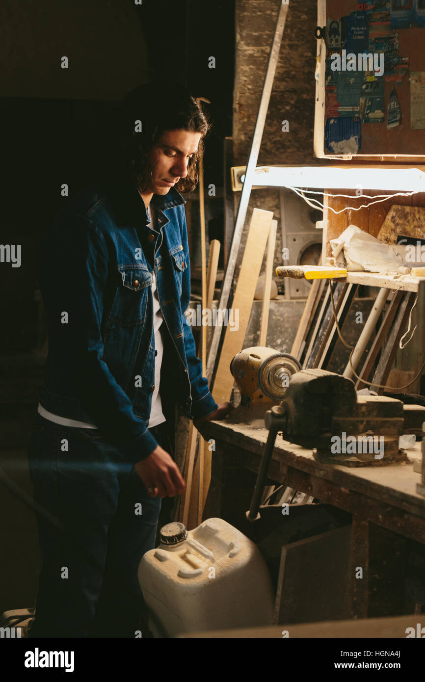 guy working at the bench one night Stock Photo - Alamy