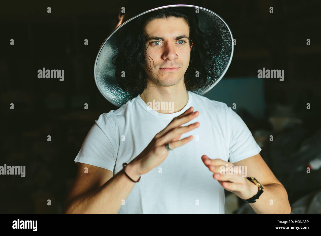 Portrait of a young man in strange unusual hat Stock Photo - Alamy