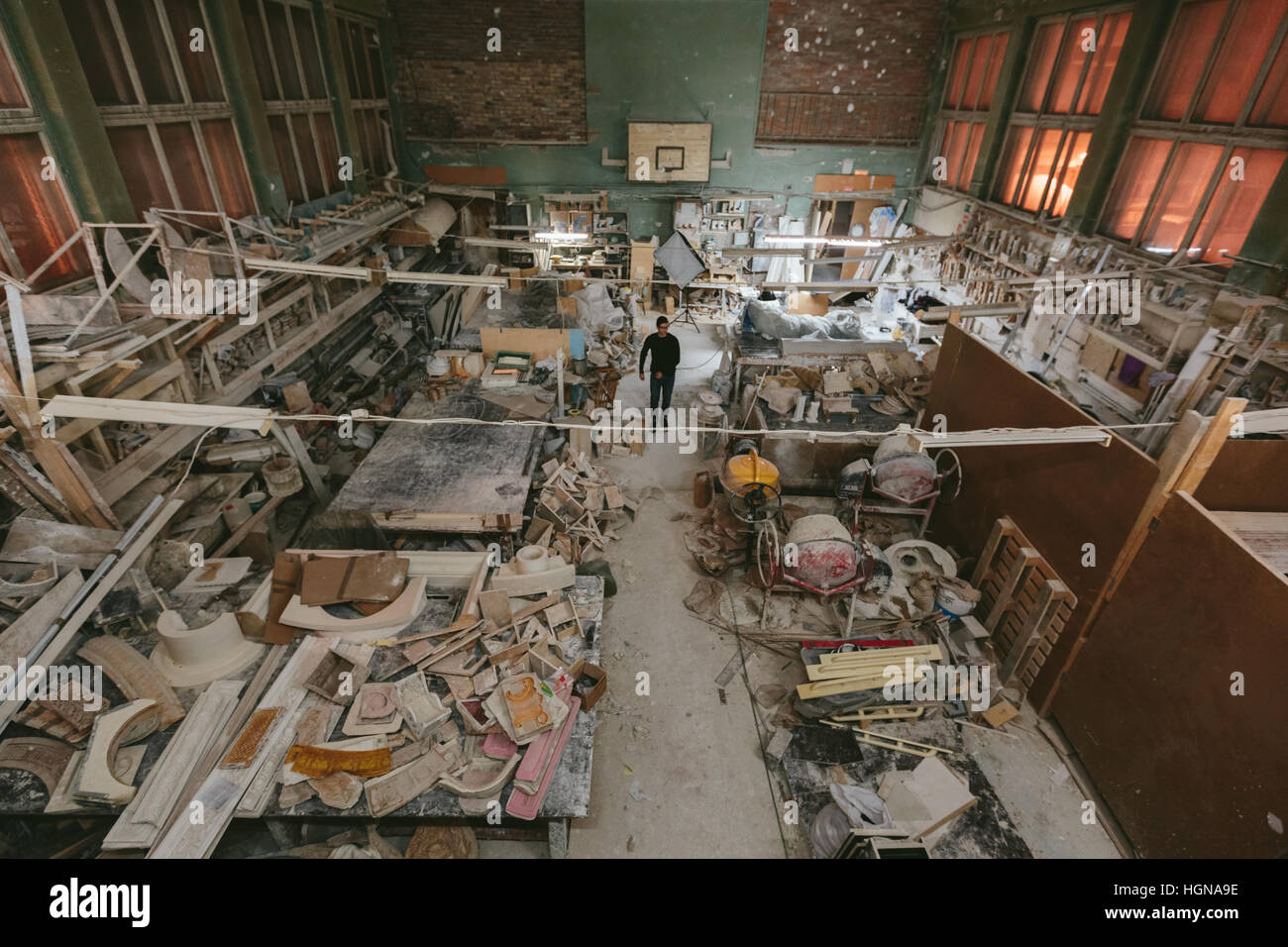 Factory for Production of plaster molds. cluttered dusty old warehouse ... Factory for Production of plaster molds. cluttered dusty old warehouse ...